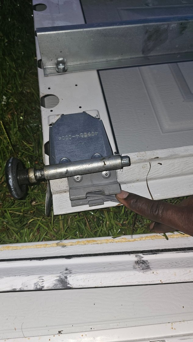 Older type plastic riveted hinge garage door folded on itself ...