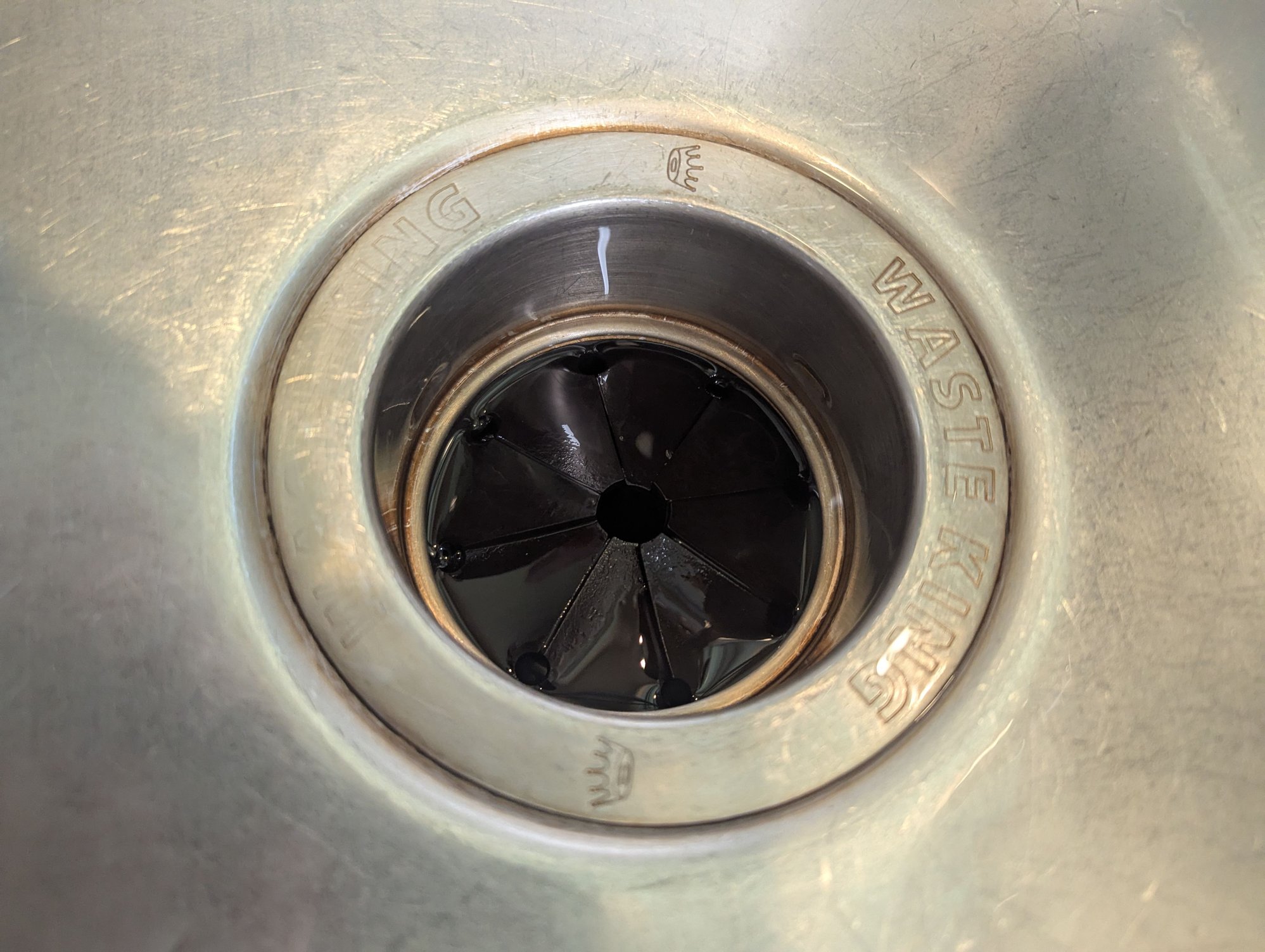 How do I replace this garbage disposal splash guard? - DoItYourself.com ...