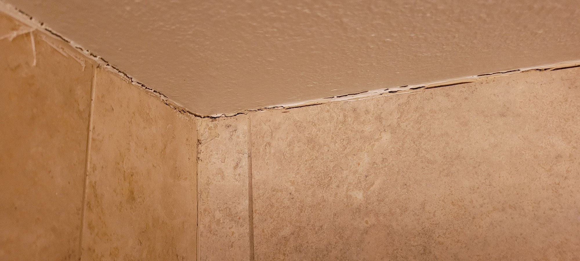 Fixing Caulk and Grout where shower tiles meet ceiling - DoItYourself ...